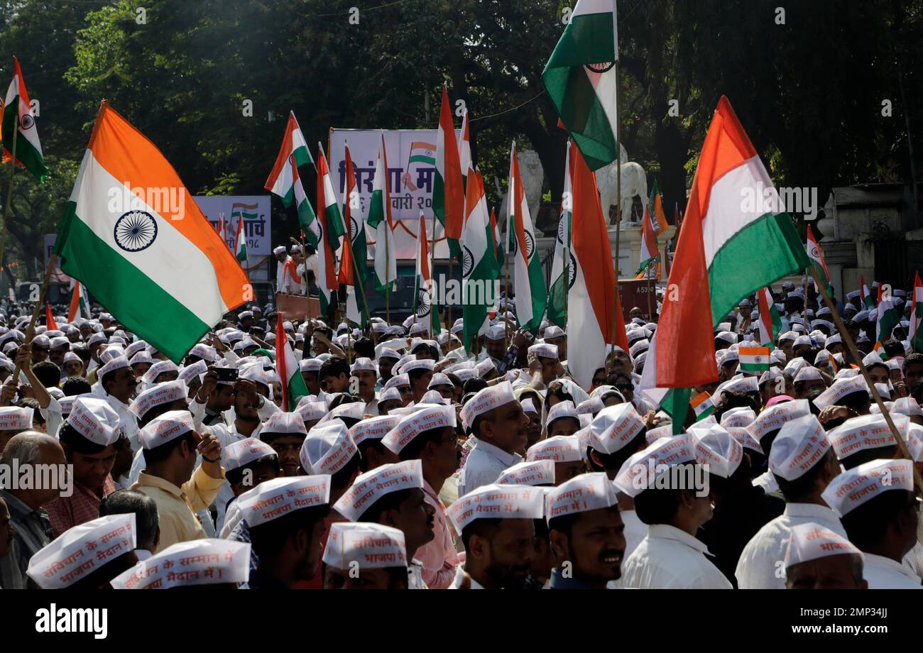 Bharatiya Janta Party workers hold the Indian flag during a rally to ...