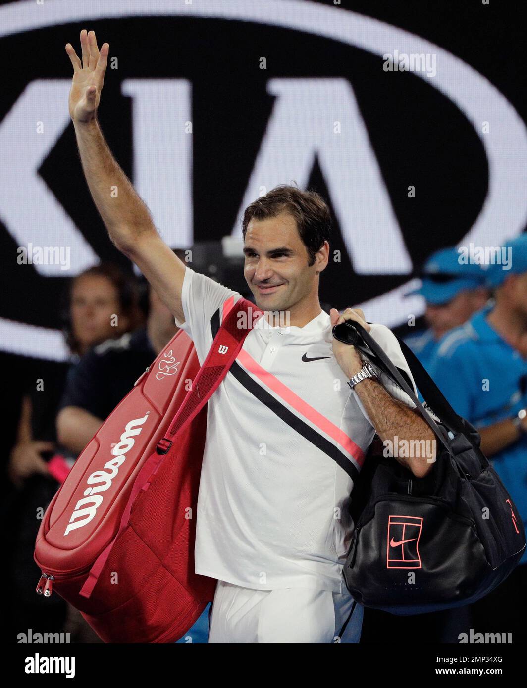 Switzerland's Roger Federer waves as he leaves Rod Laver Arena ...