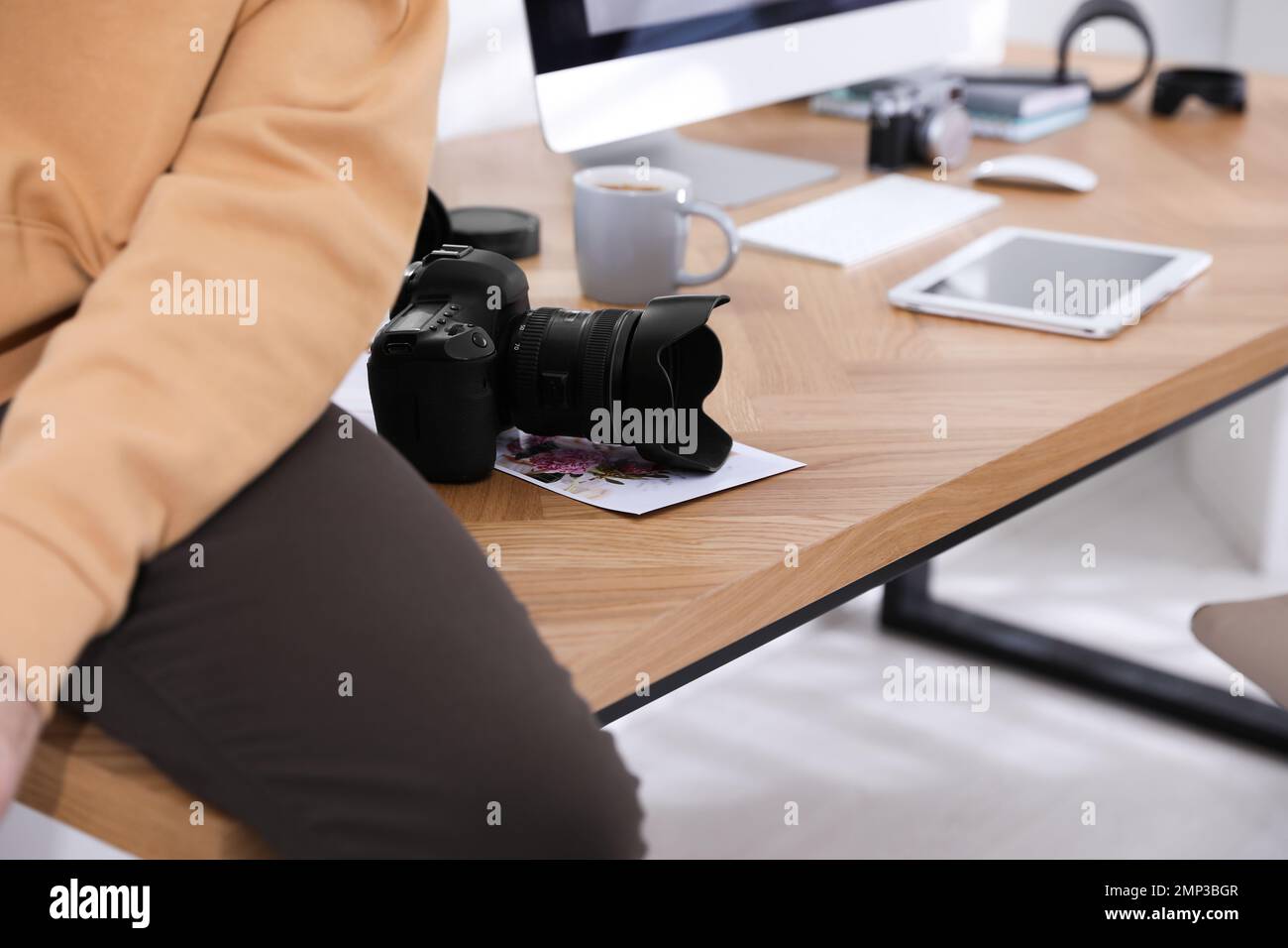 Professional photographer working in office, focus on camera Stock ...