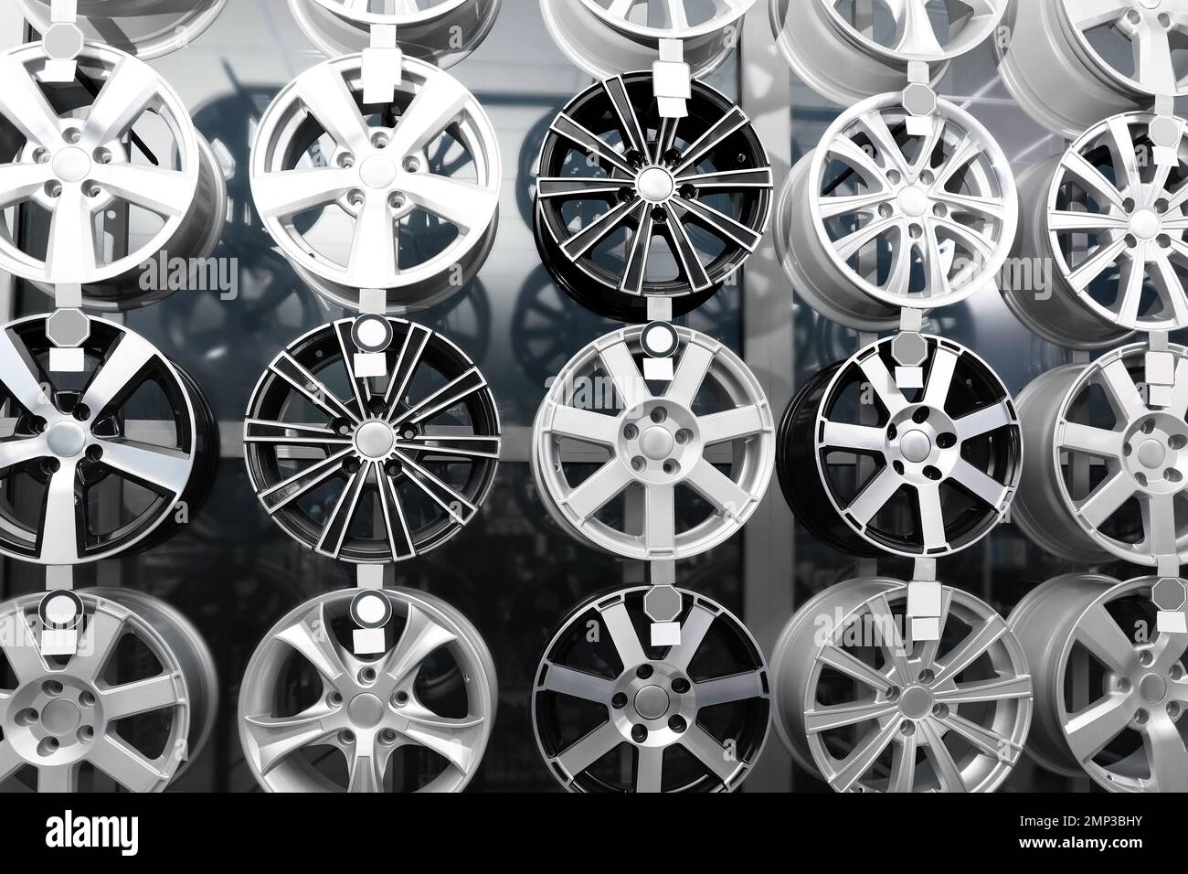 Alloy wheels on display in auto store Stock Photo - Alamy