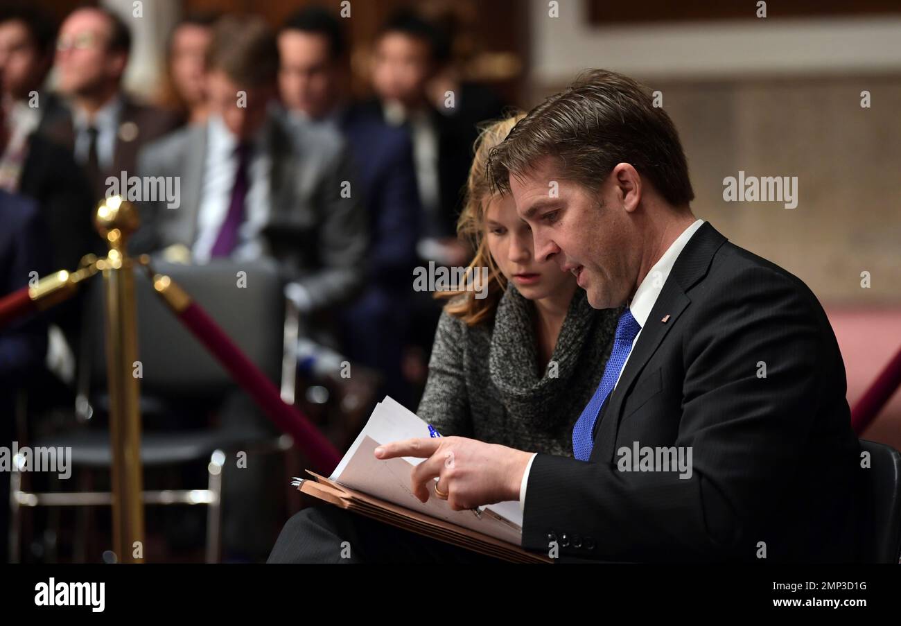 Sen. Ben Sasse, R-Neb., helps his daughter Alexandra Sasse, 14, with ...