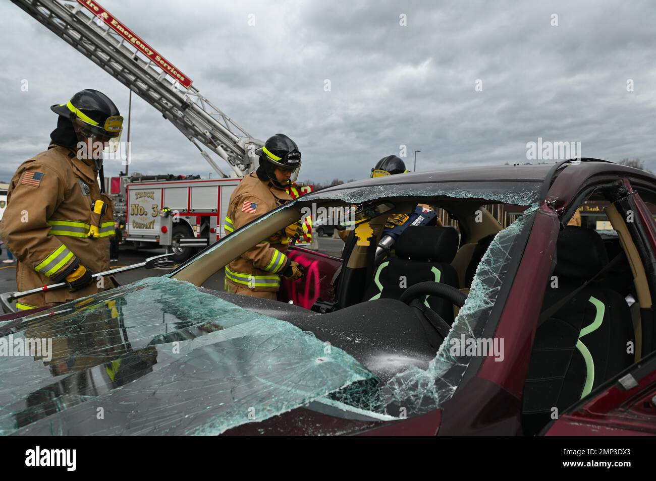 U.S. Air Force firefighters from the 673d Civil Engineer Squadron cut ...