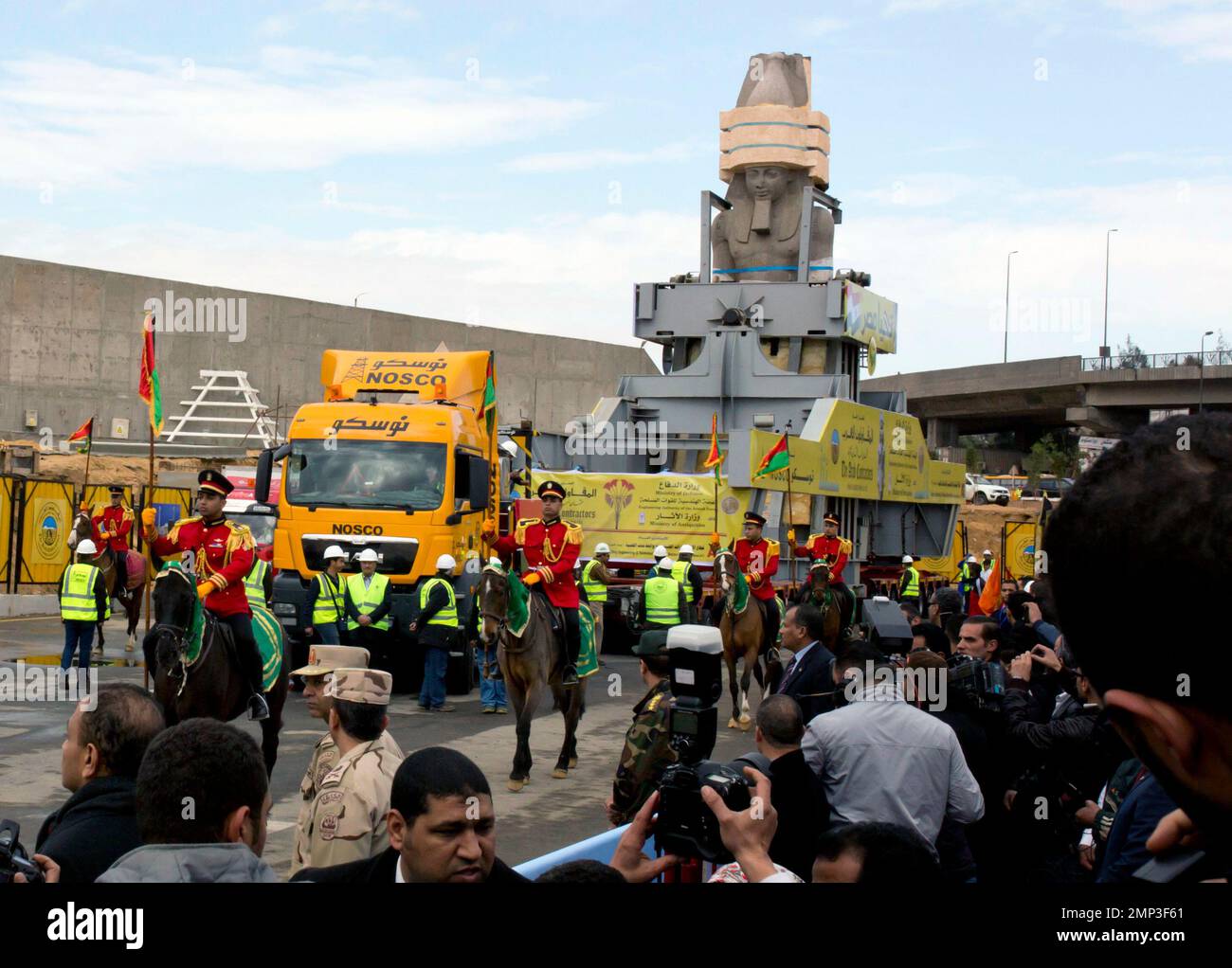 The statue of Egyptian Pharaoh Ramses II is surrounded by honour guards ...
