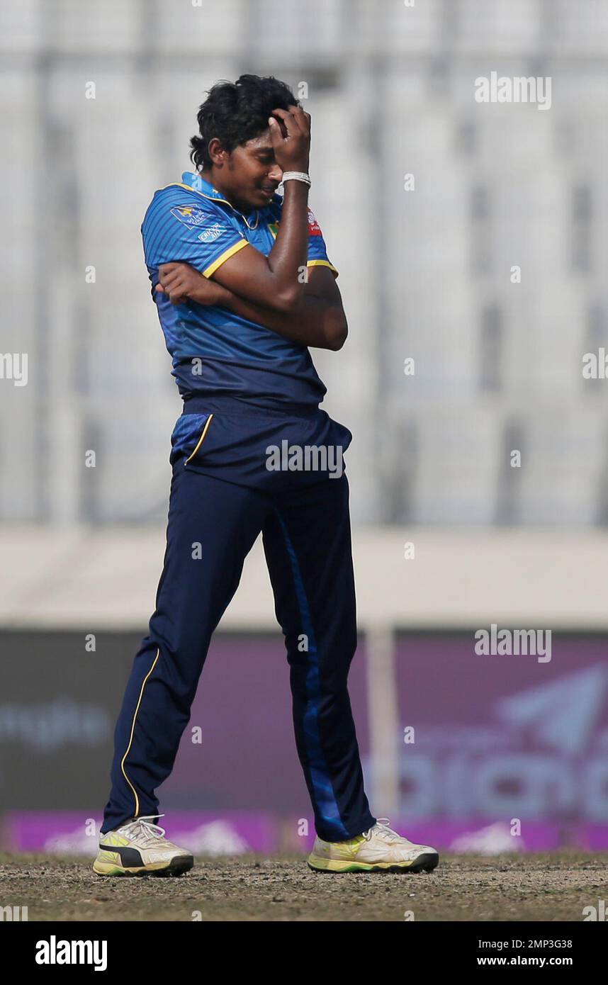 Sri Lanka's Lakshan Sandakan reacts as he bowls during the Tri-Nation ...