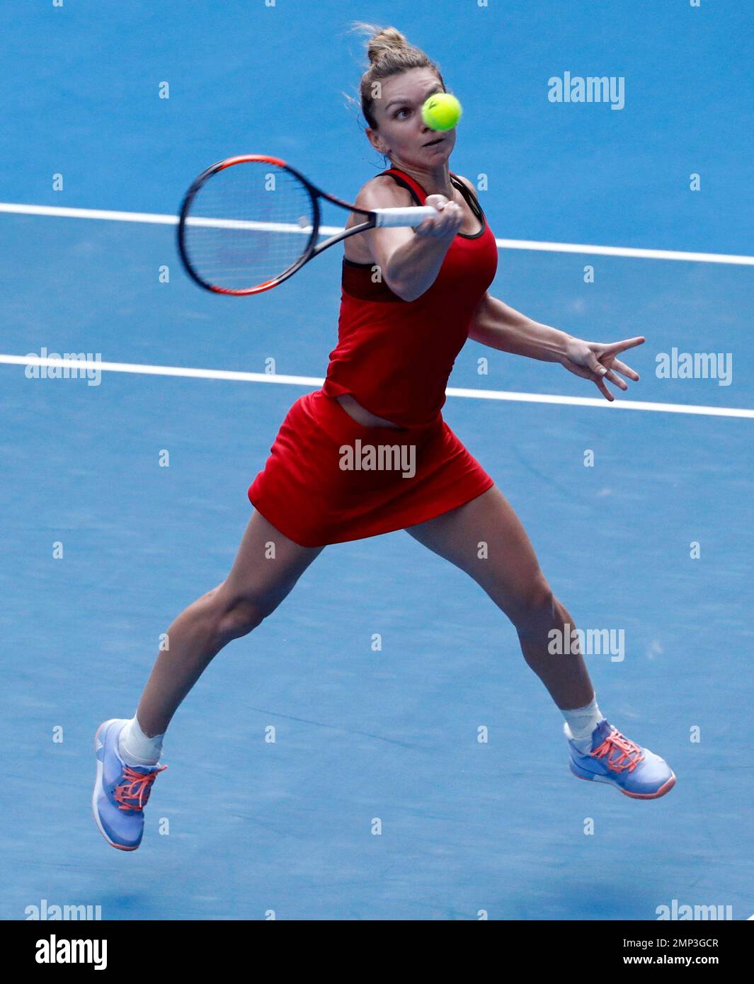 Romania's Simona Halep hits a forehand return to Germany's Angelique ...