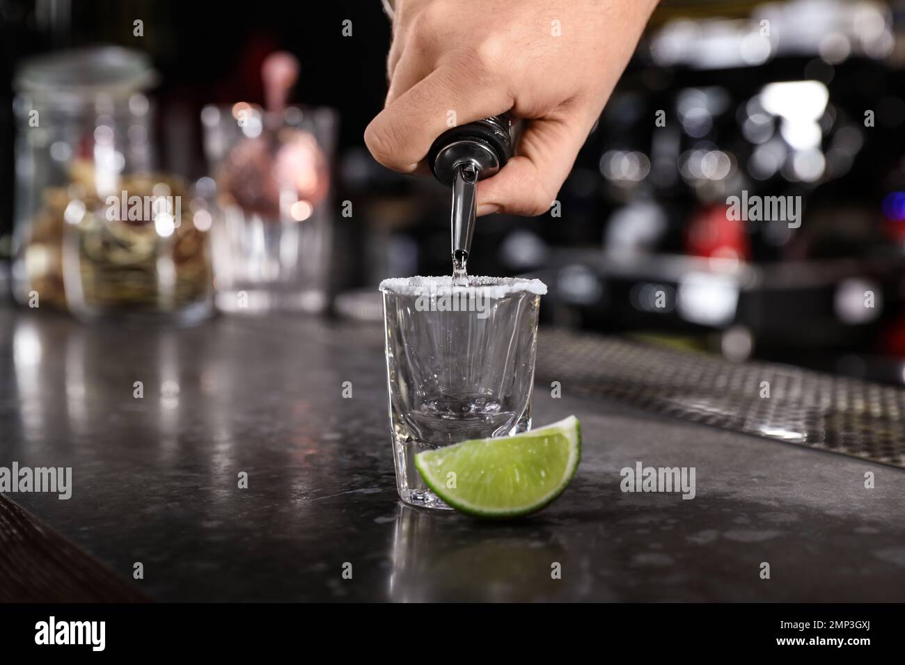 Person pouring tequila glass hi-res stock photography and images - Alamy