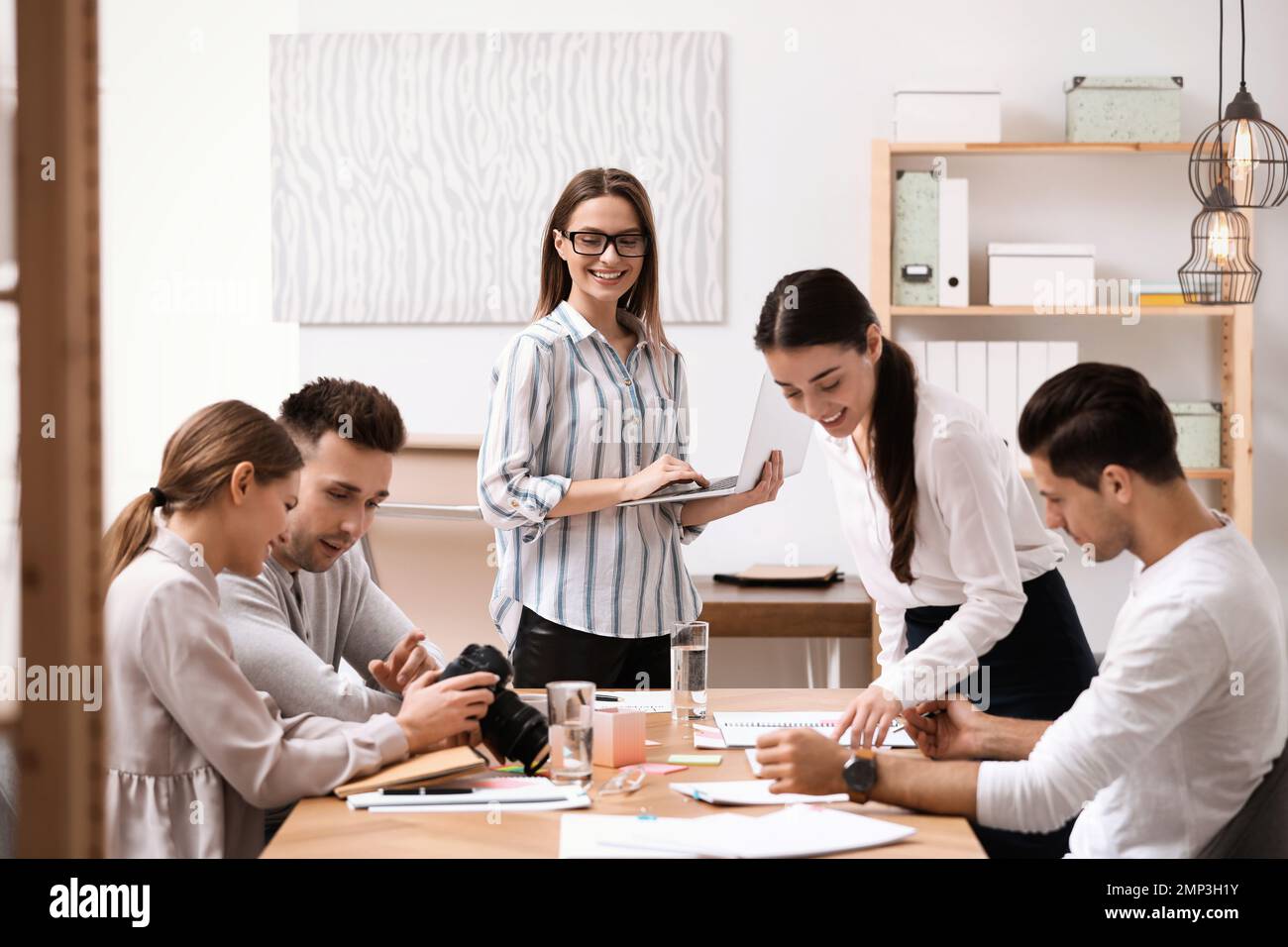 Team of professional journalists working in office Stock Photo - Alamy