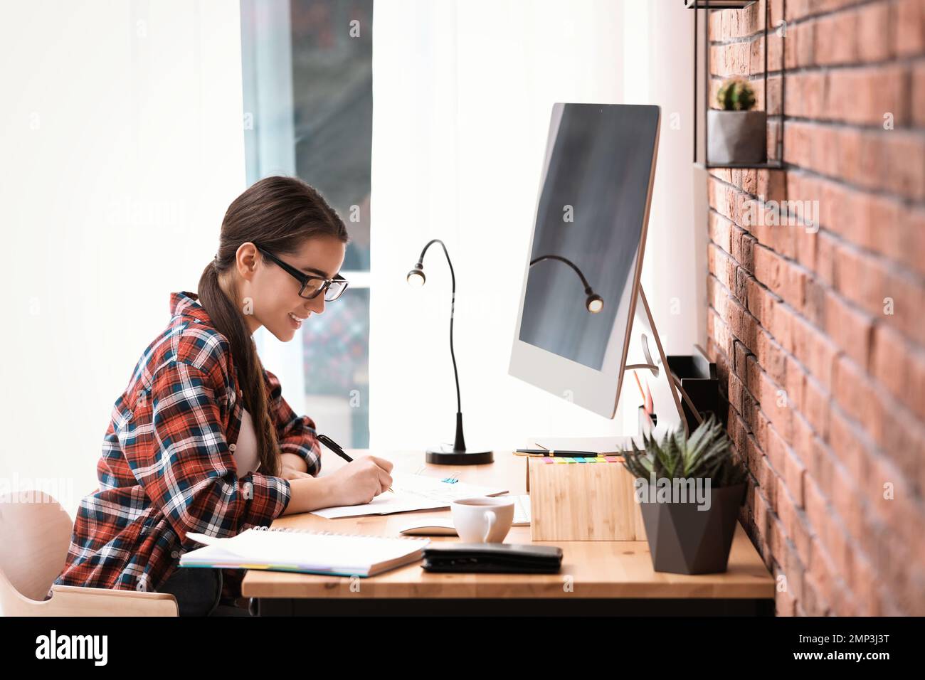 Professional journalist working with computer in office Stock Photo - Alamy