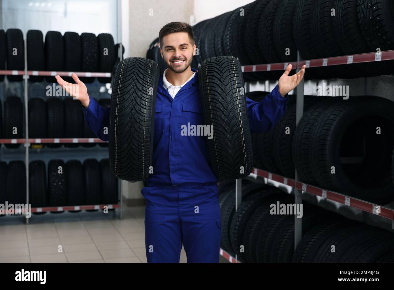 Warehouse many tires man hi-res stock photography and images - Alamy