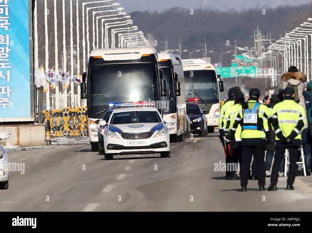 Vehicles carrying a North Korean delegation and female ice hockey ...