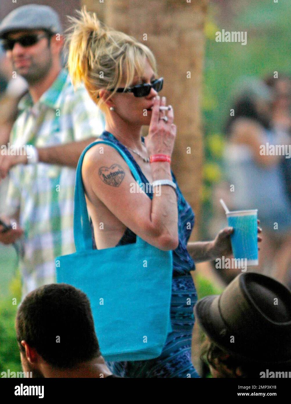 Melanie Griffith takes a smoke break whilst enjoying the Coachella ...