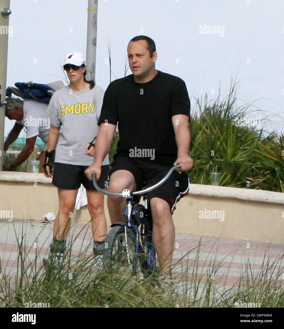 Exclusive!! Owen Wilson and Vince Vaughn take a Sunday afternoon bike ride along the Miami Beach ...