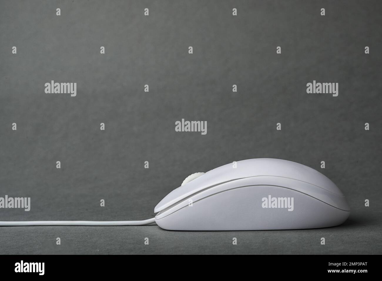 Modern wired computer mouse on grey background. Space for text Stock Photo - Alamy