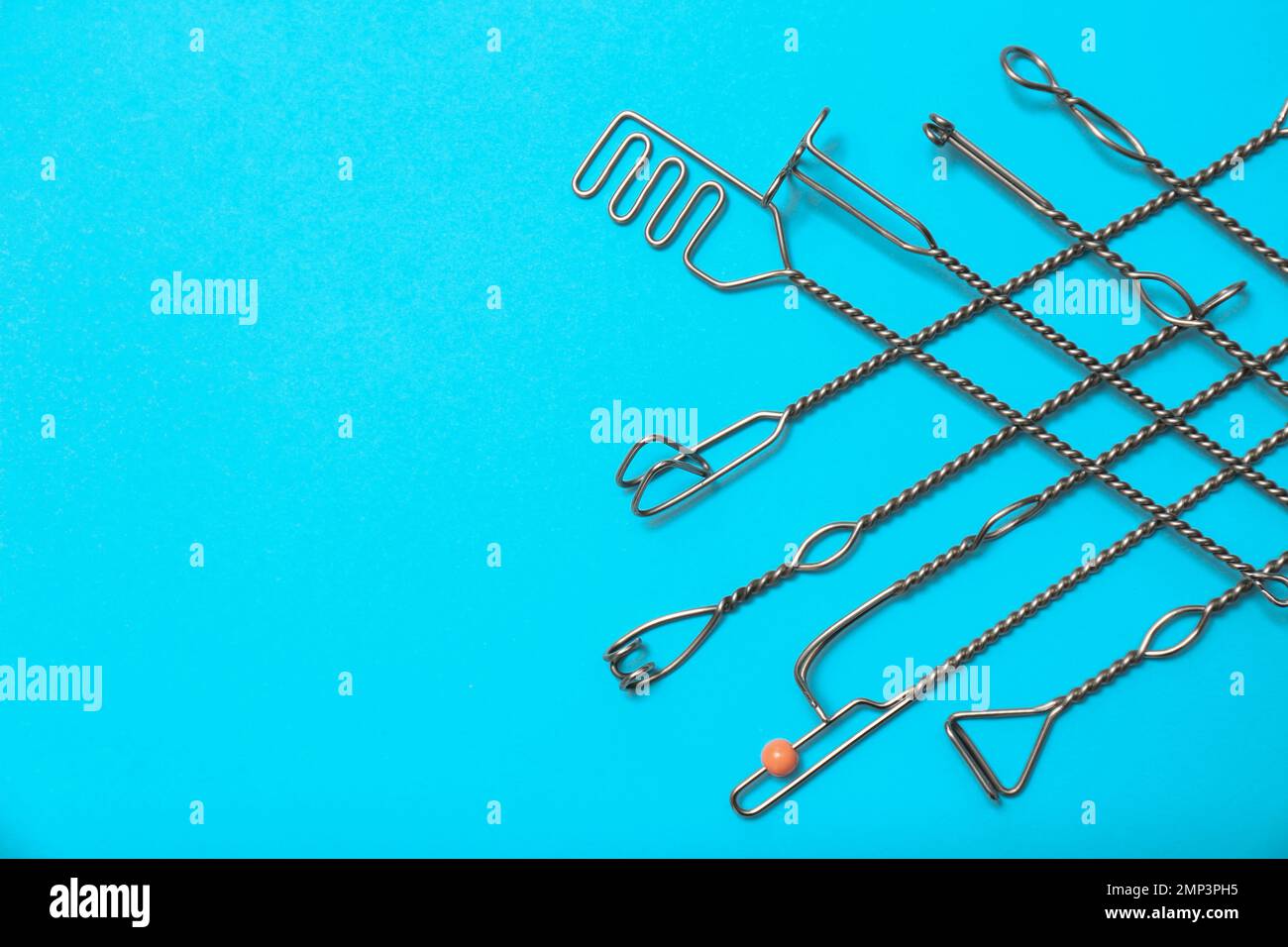 Set of logopedic probes for speech therapy on light blue background ...