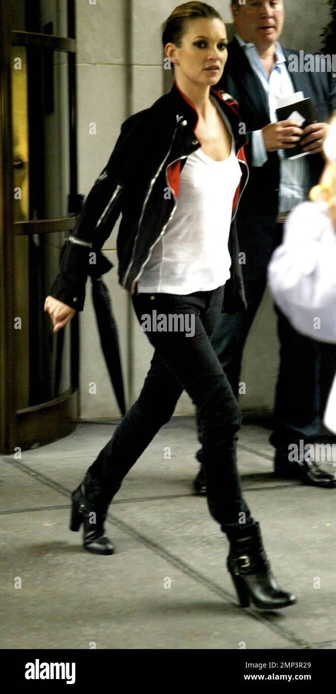The seemingly bra-less Kate Moss wears a very revealing t-shirt as she ...