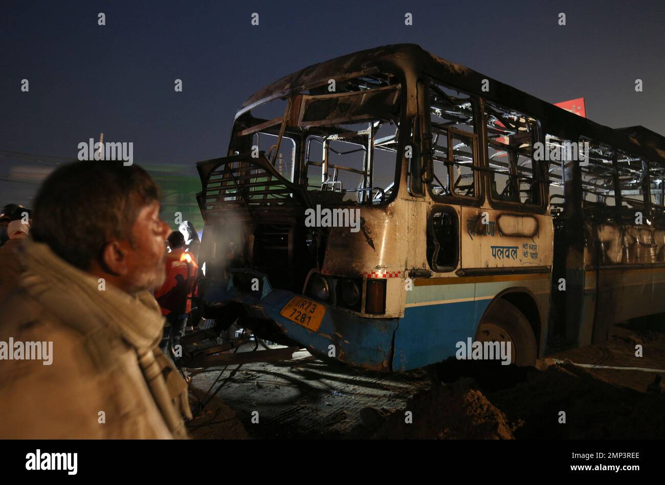 Driver Sukhbir Singh, stands next to a Haryana Roadways bus that was ...