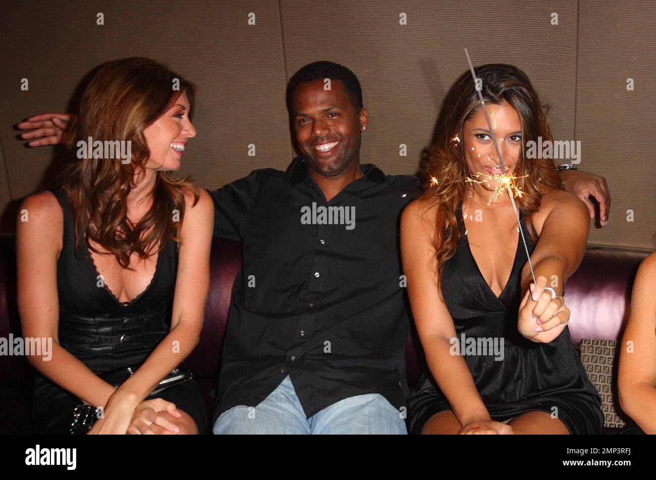 "Extra" host A.J. Calloway poses with models at the Blackjack ...