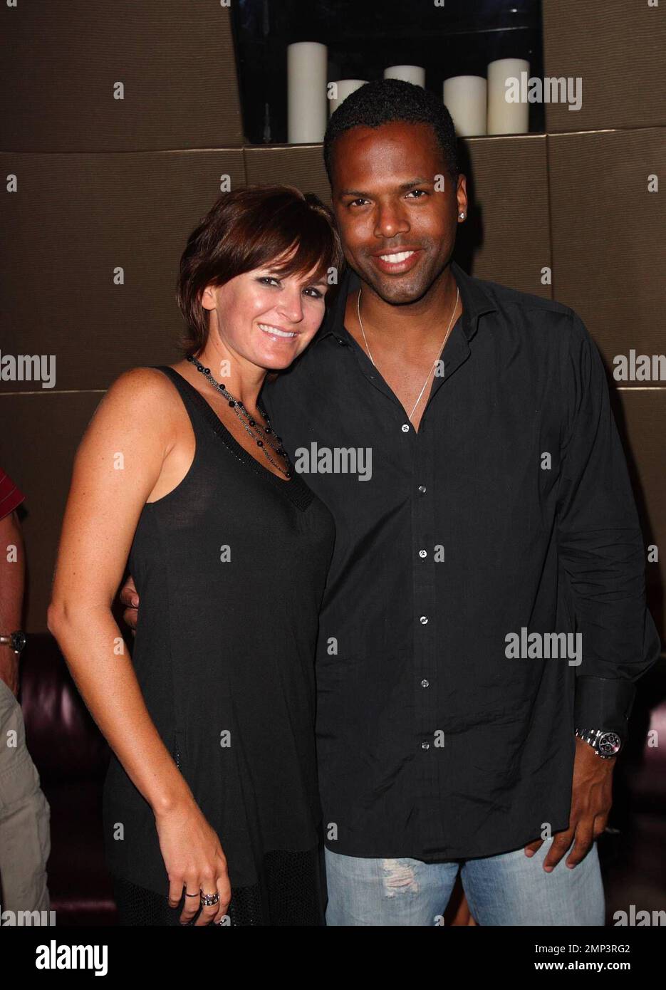 "Extra" host A.J. Calloway and Aura owner Candace Carrell attend the ...