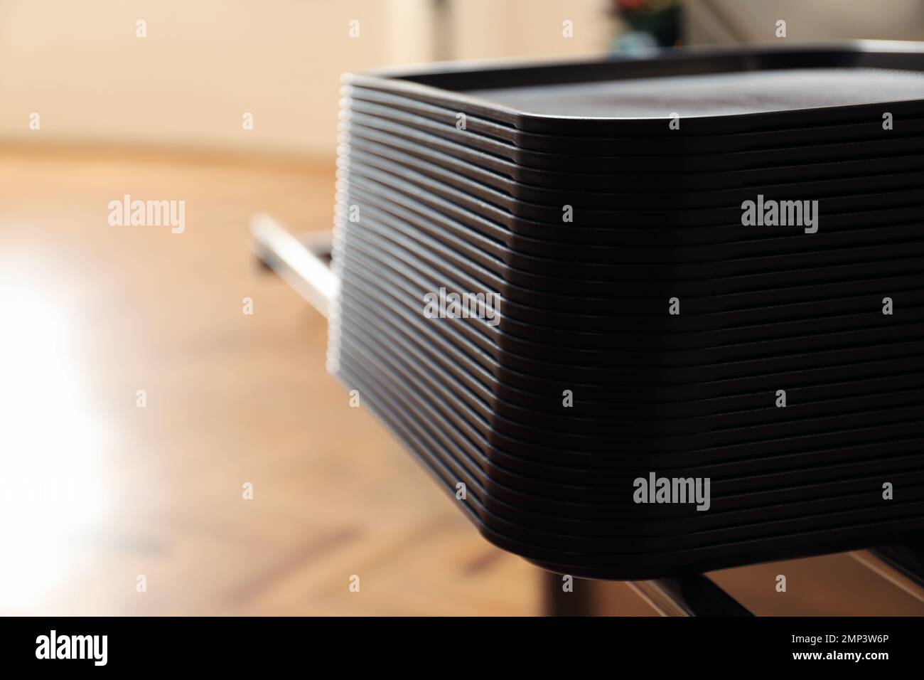 Stack of plastic trays for food in school canteen Stock Photo - Alamy