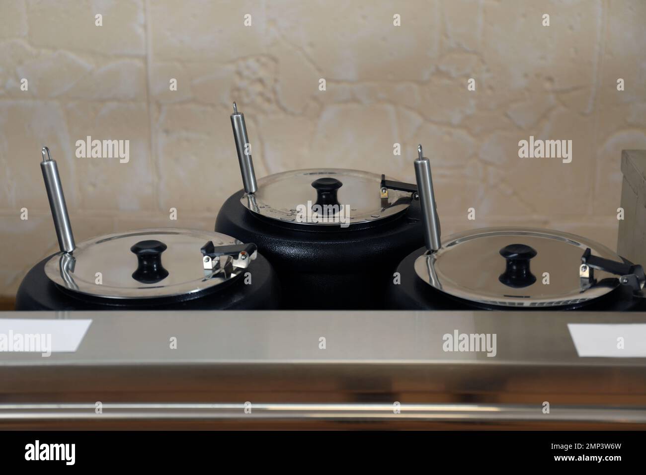 Cooking pots with tasty food in school canteen Stock Photo - Alamy