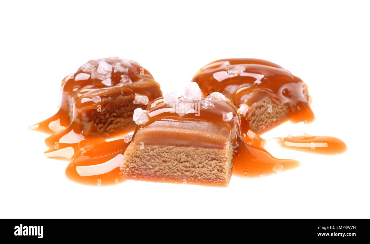 Delicious salted caramel with sauce on white background Stock Photo - Alamy