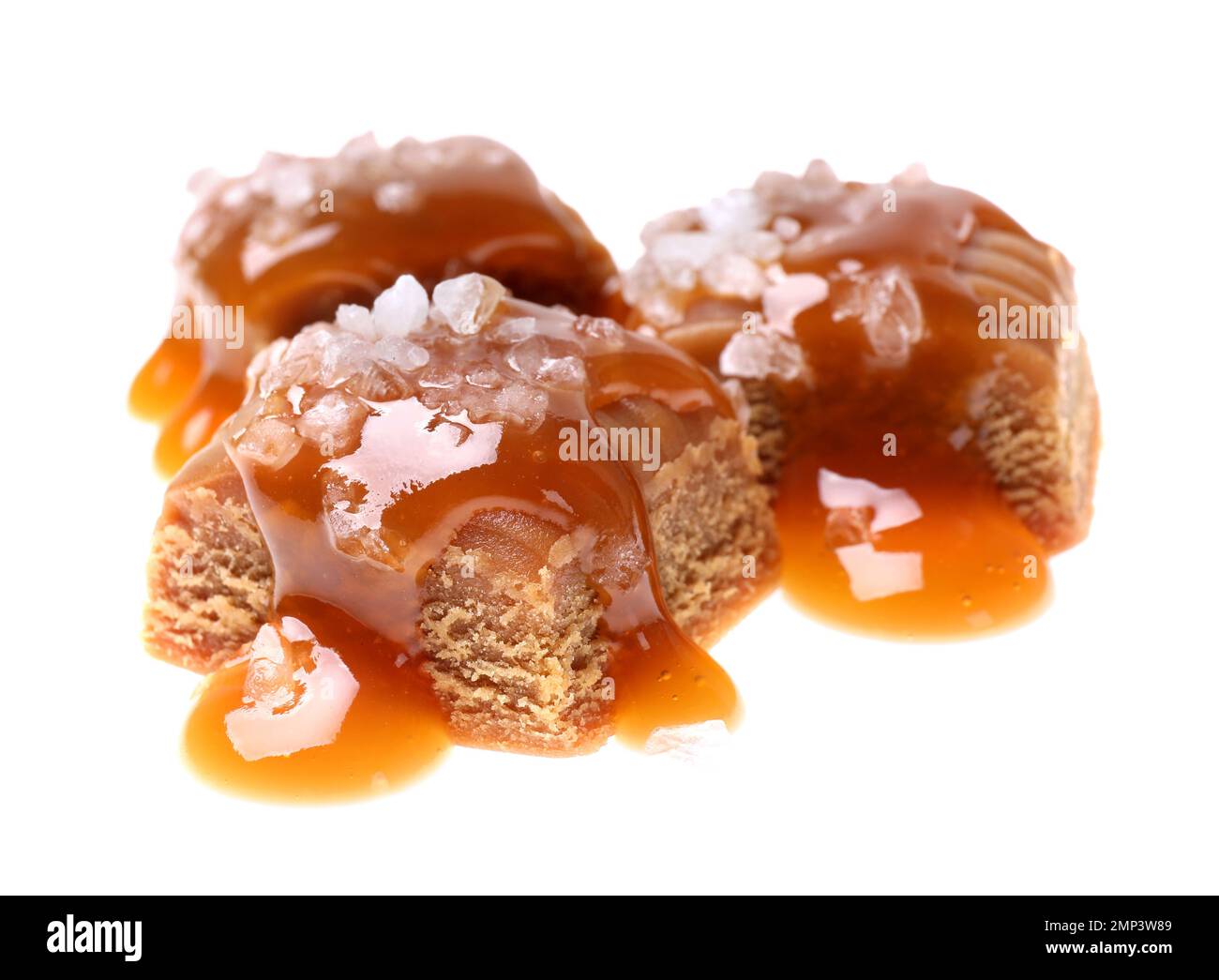 Delicious salted caramel with sauce on white background Stock Photo - Alamy