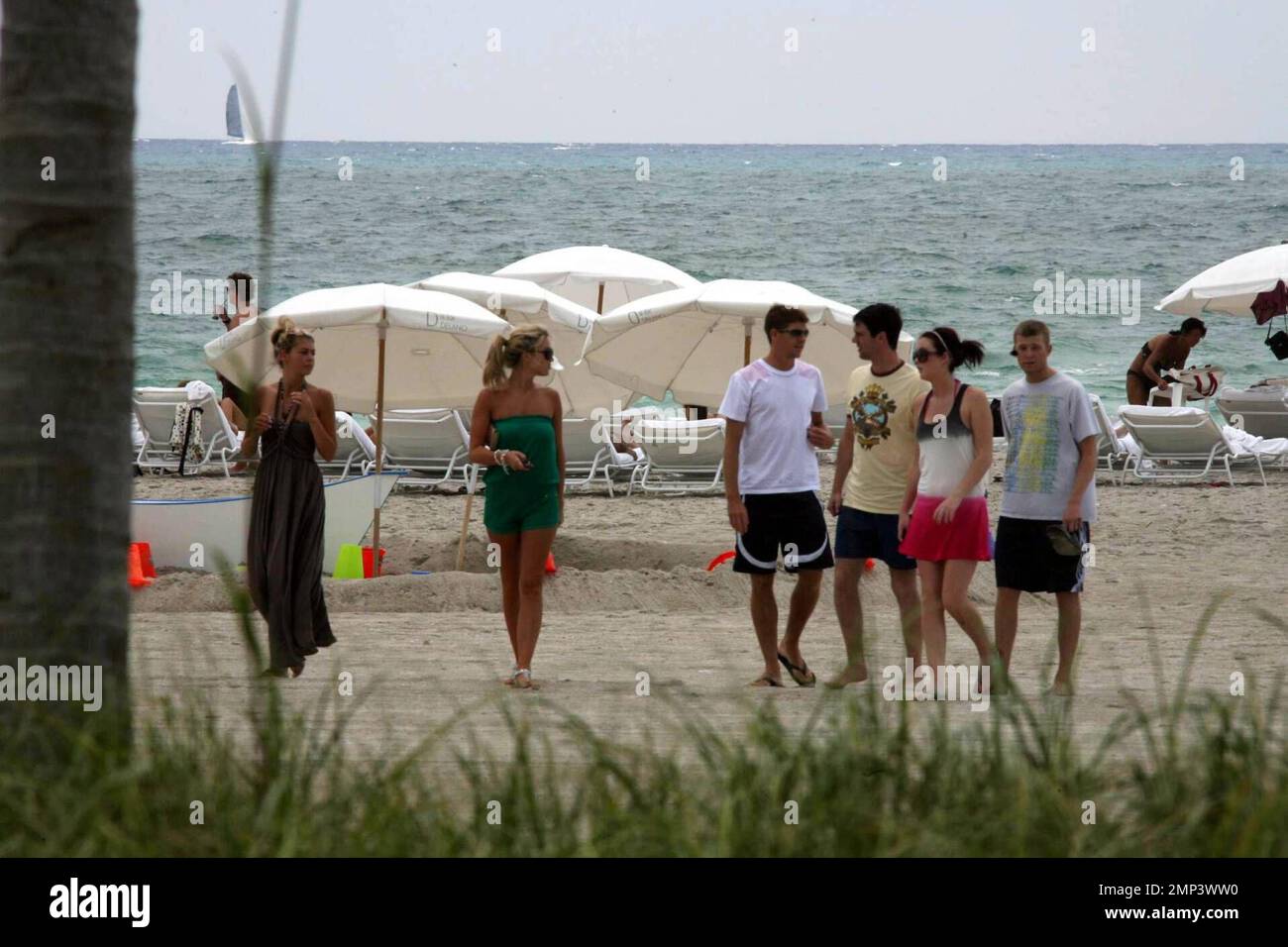 Steven Gerrard, Alex Curran and friends take a stroll on the beach ...