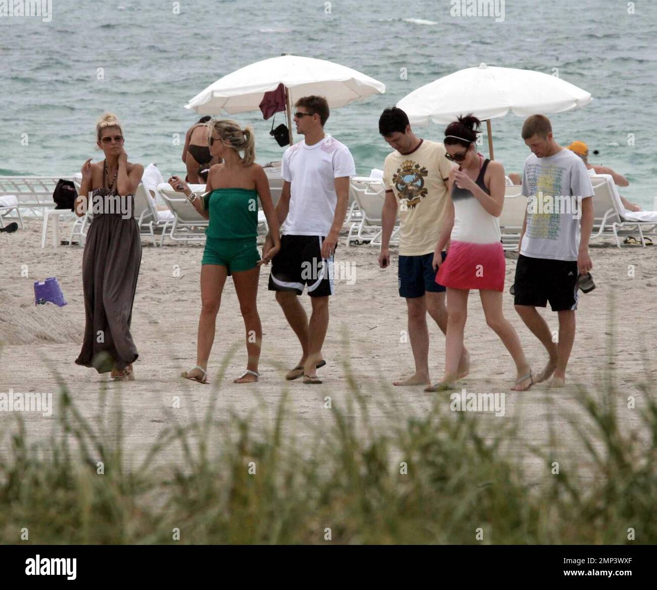 Steven Gerrard, Alex Curran and friends take a stroll on the beach ...
