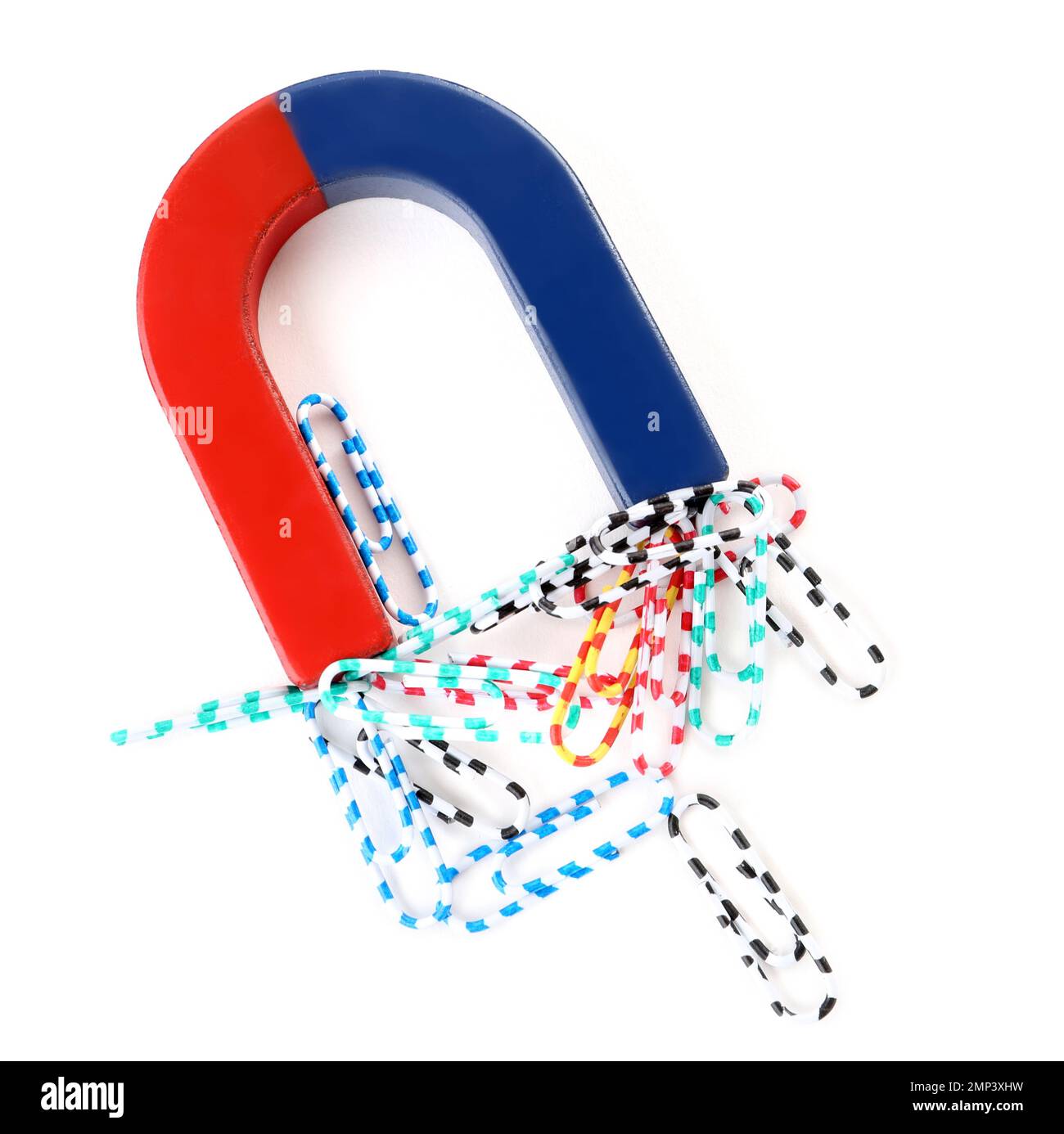 Magnet attracting paper clips on white background, top view Stock Photo ...