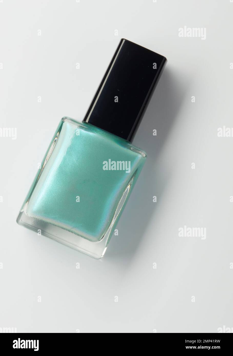 Coloured nail polish bottle cut out plain background shiny nails ...