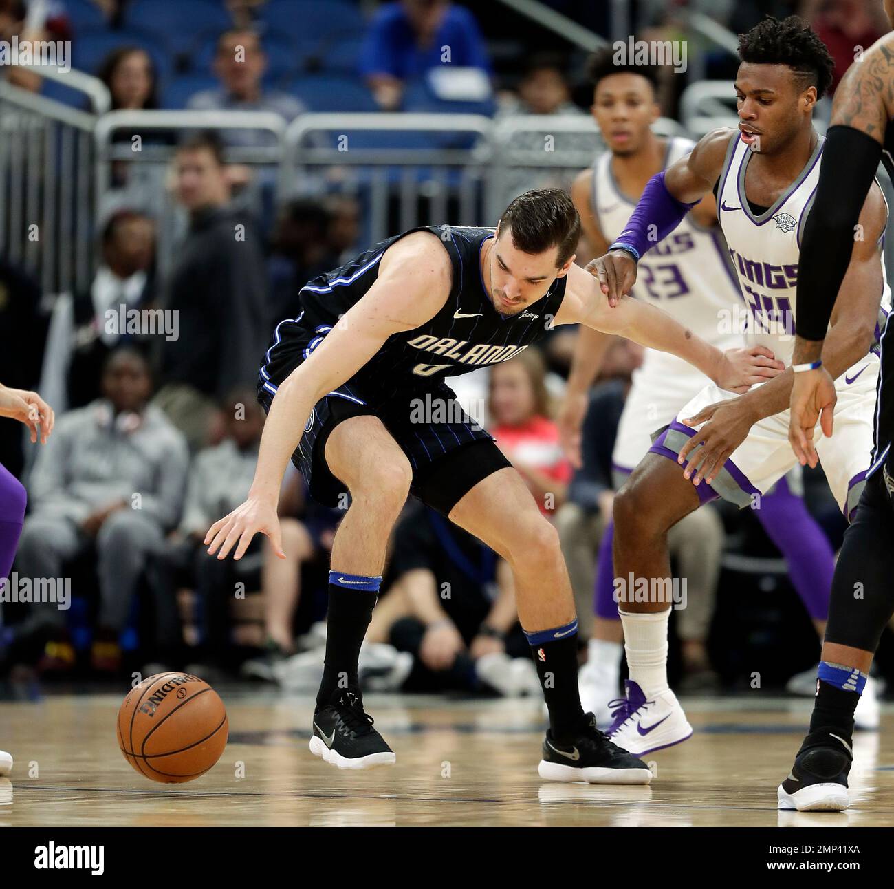 Orlando Magic's Mario Hezonja, left, goes after a loose ball in front ...