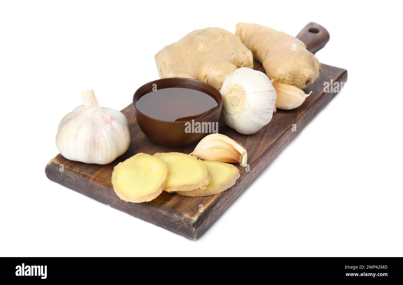 Fresh garlic and other natural cold remedies isolated on white Stock ...
