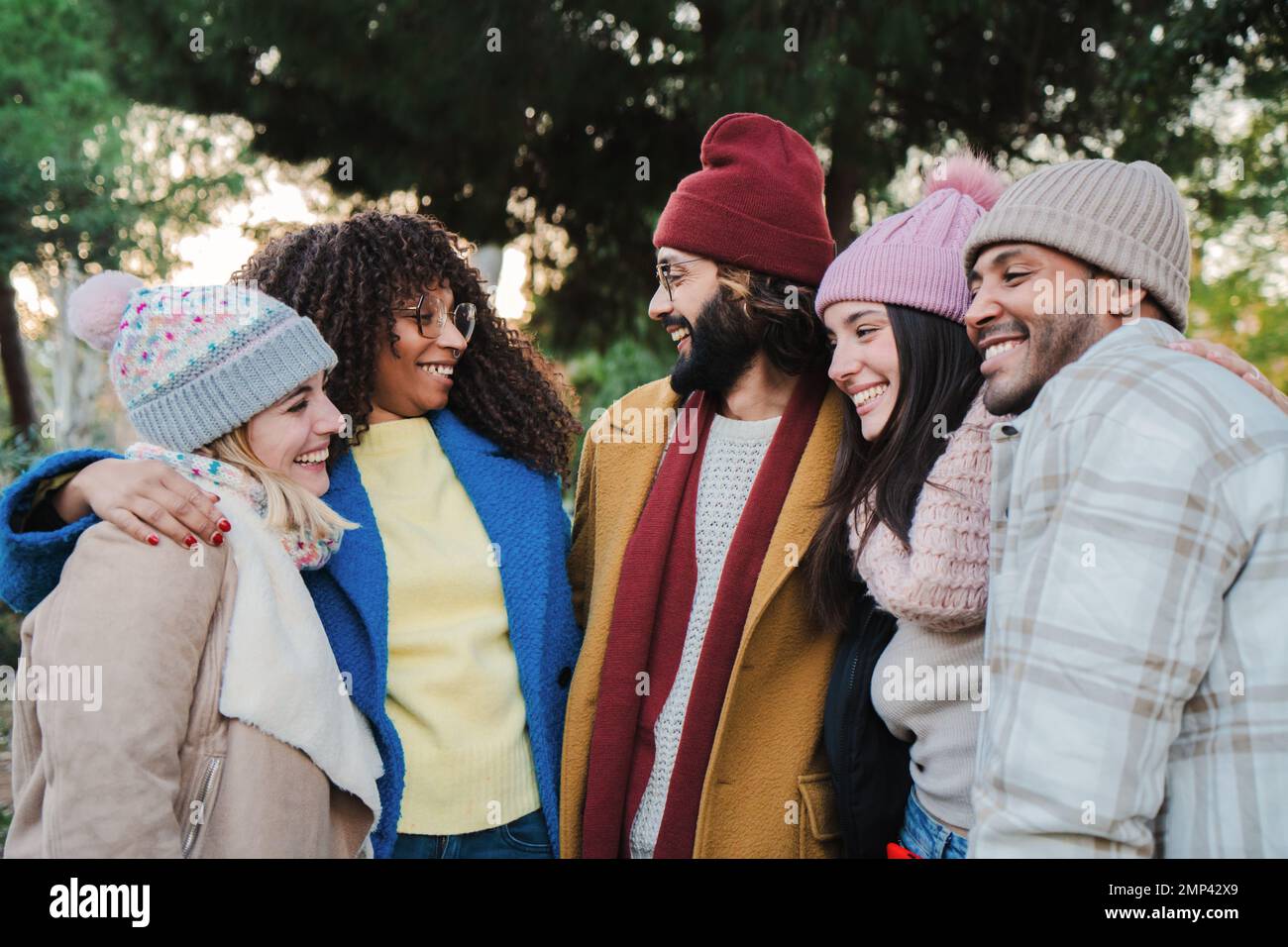 Group young interracial friends walking hi-res stock photography and ...