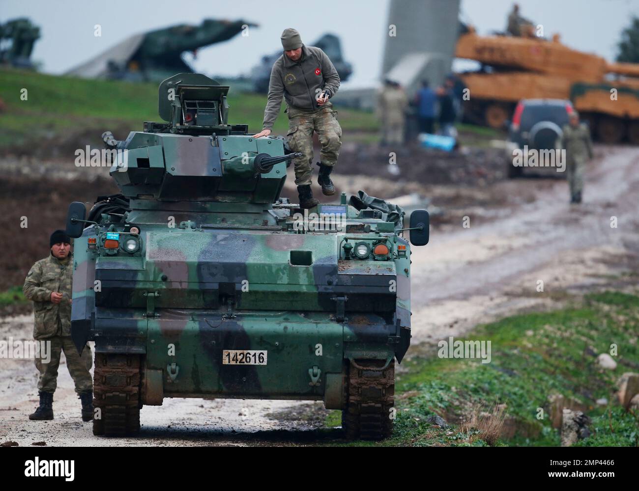 Turkish soldiers on an armoured personnel carrier secure a staging area ...