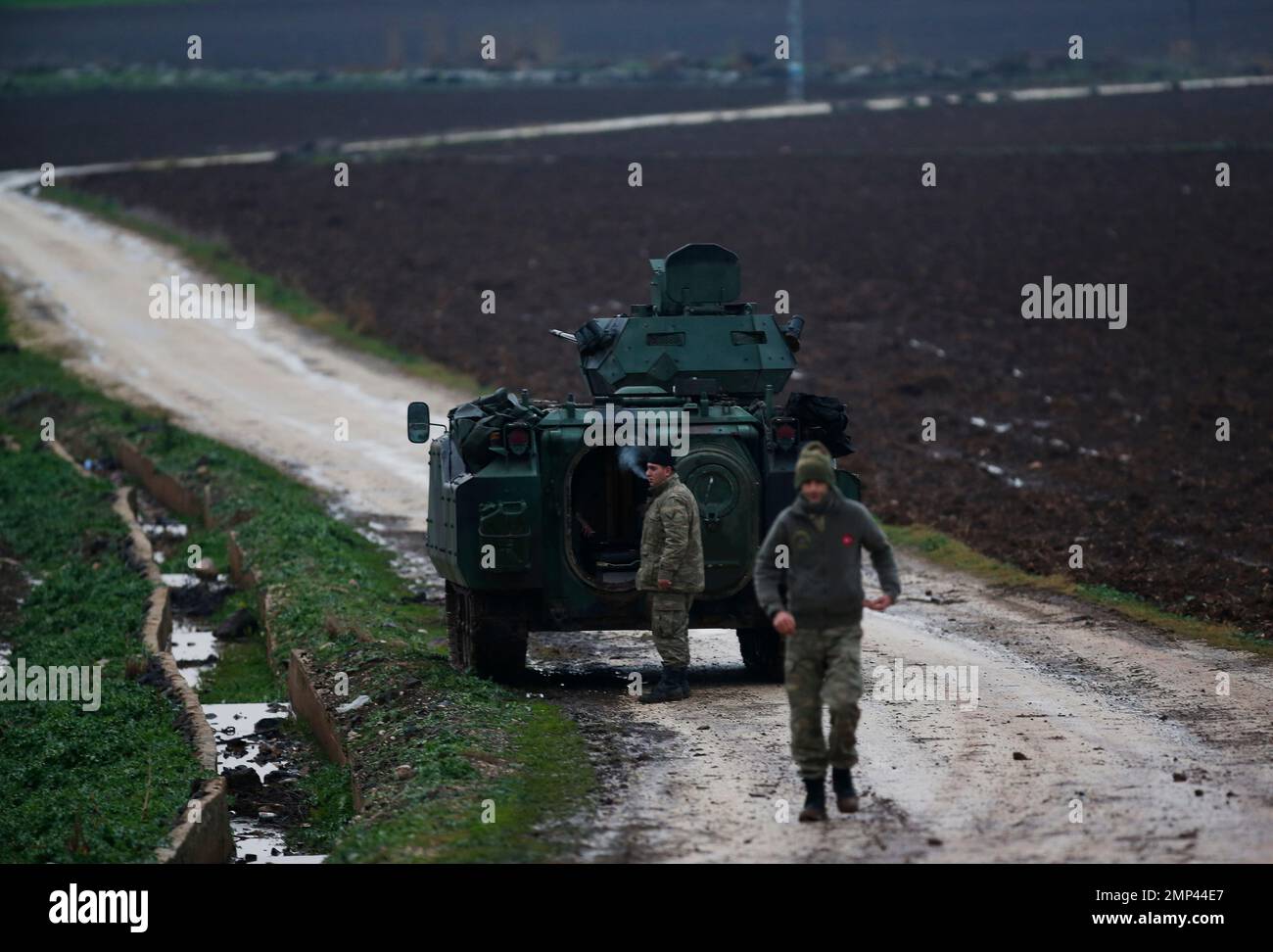Turkish soldiers on an armoured personnel carrier secure a staging area ...