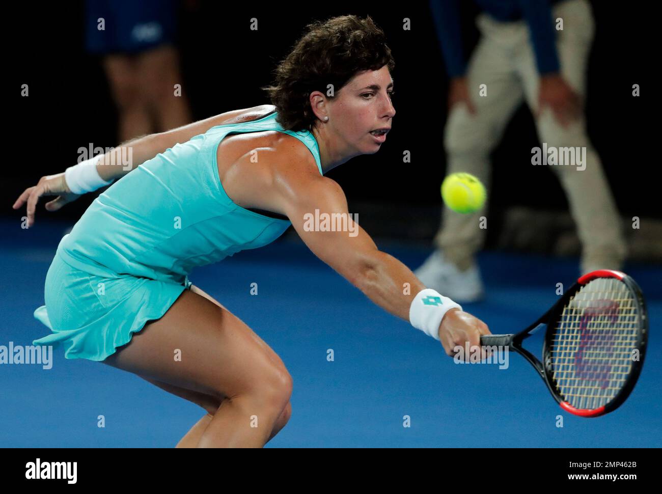 Spain's Carla Suarez Navarro hits a backhand return to Denmark's ...