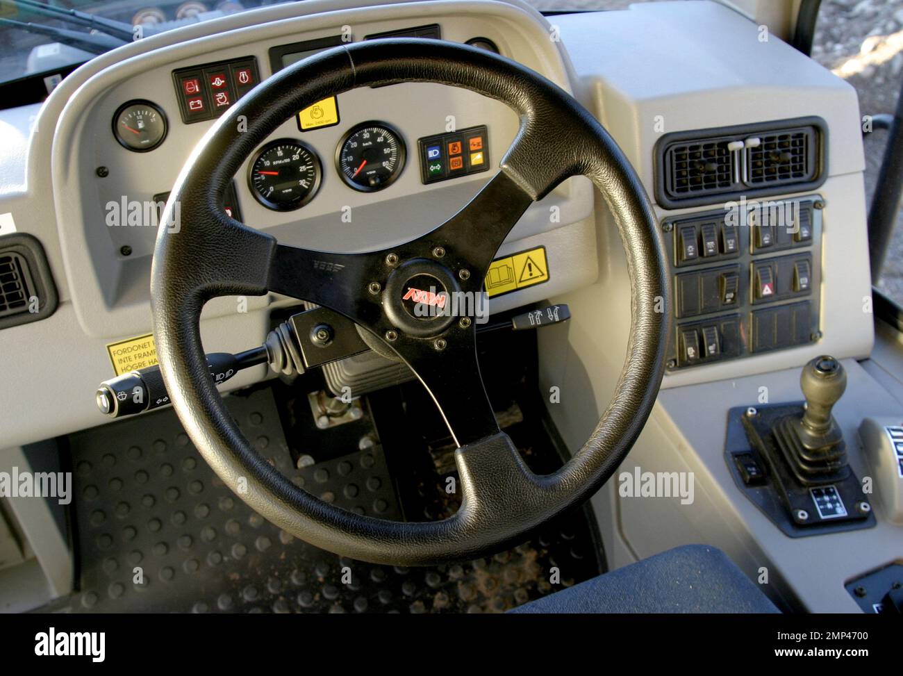 Different machines in a gravel pit. Here a Moxy MT 26 Highline dumper ...