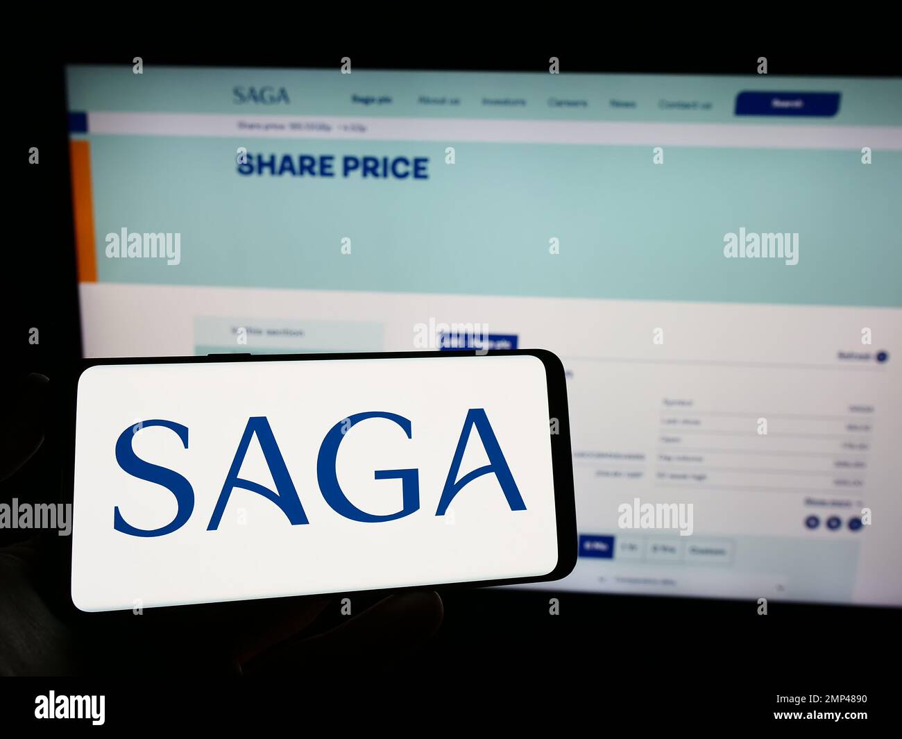 Person holding mobile phone with logo of travel and financial services ...