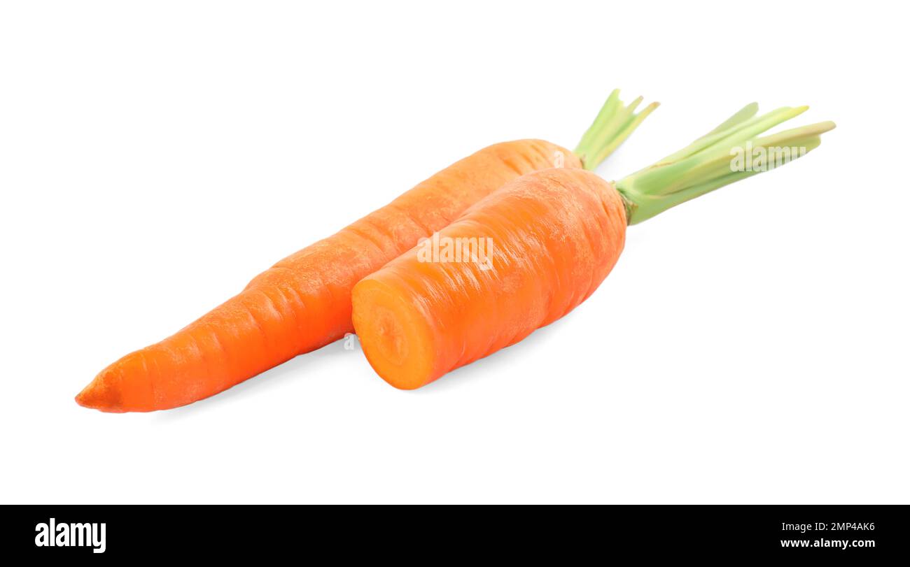 Whole and cut ripe carrots isolated on white Stock Photo - Alamy