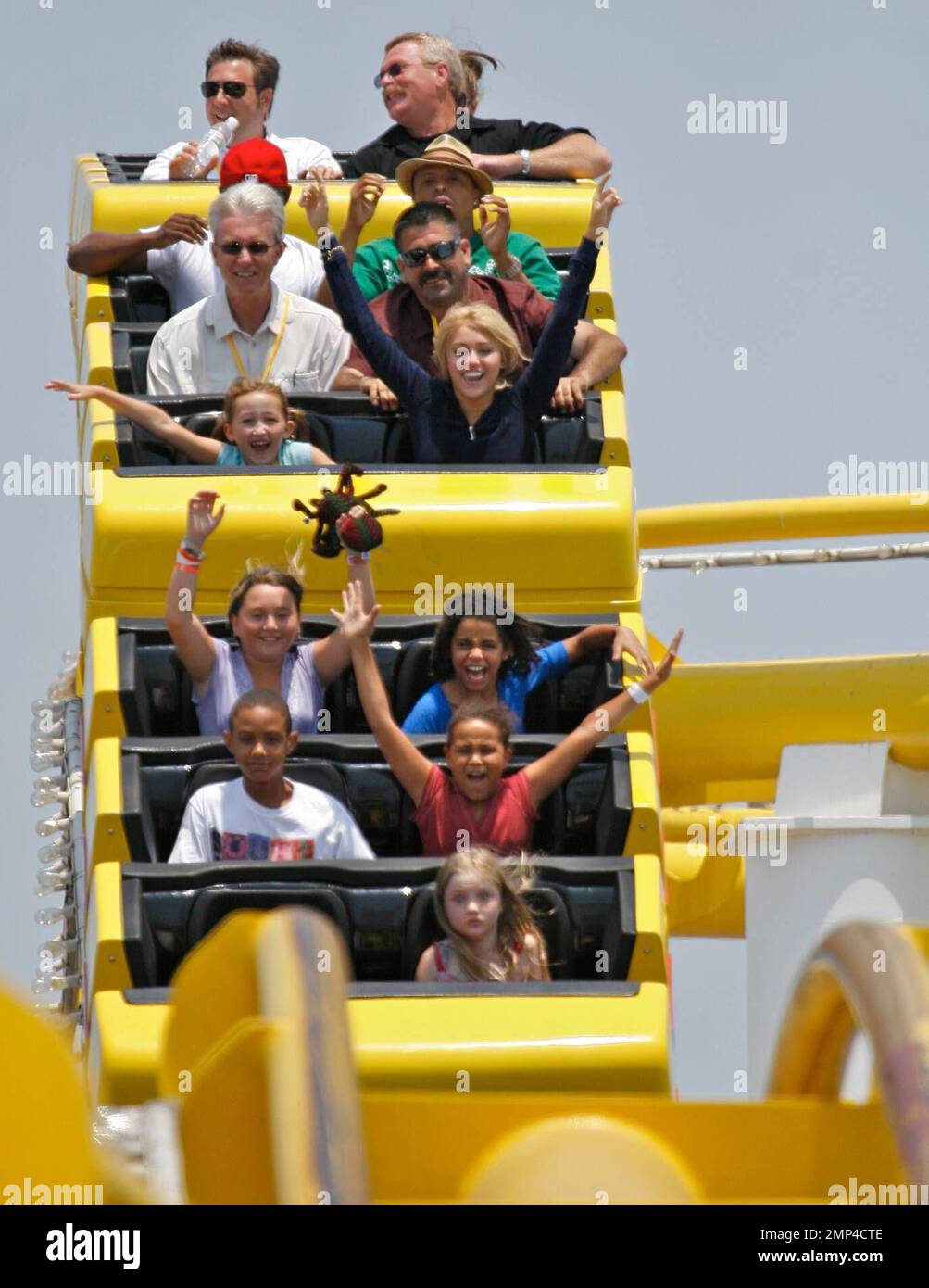 Miley Cyrus has fun on the rides with her sister (check) at the Santa ...