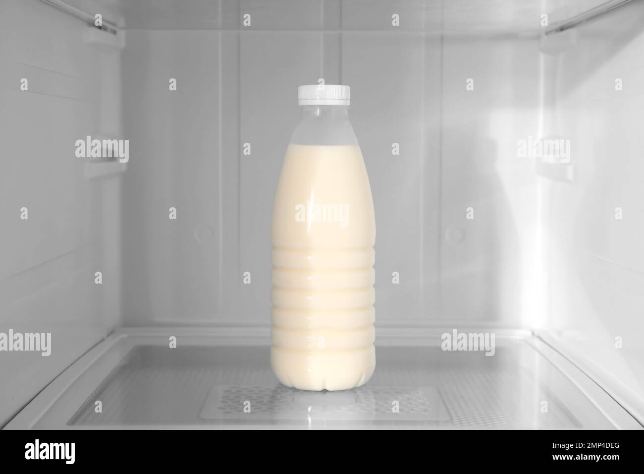 Bottle of milk on shelf inside modern refrigerator Stock Photo - Alamy