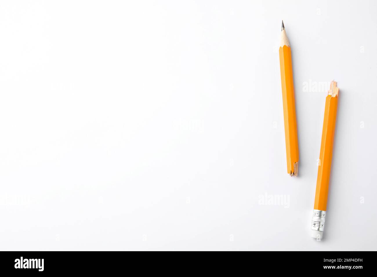 Broken graphite pencil on white background, top view. Space for text ...
