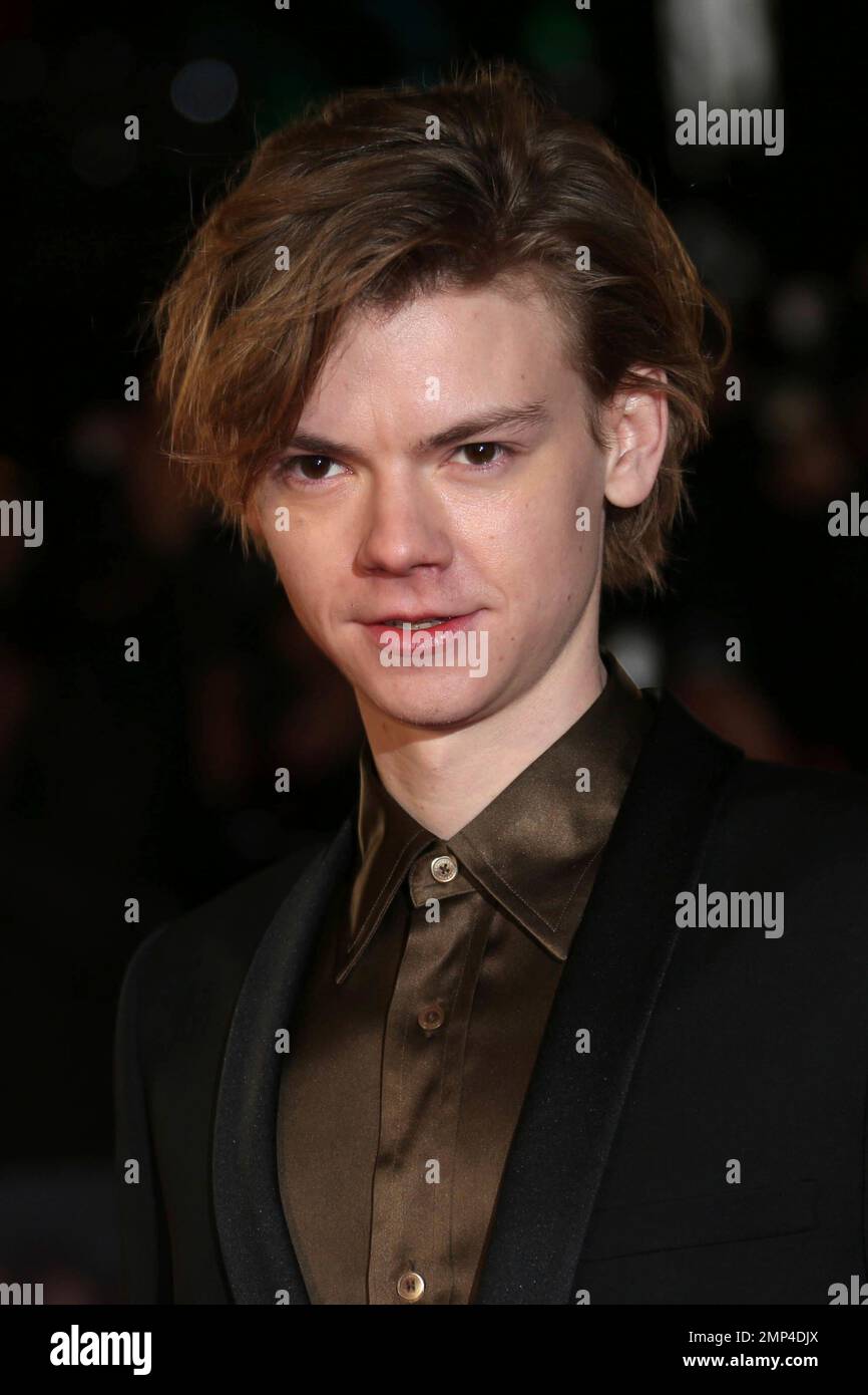 Actor Thomas Brodie-Sangster poses for photographers upon arrival at ...
