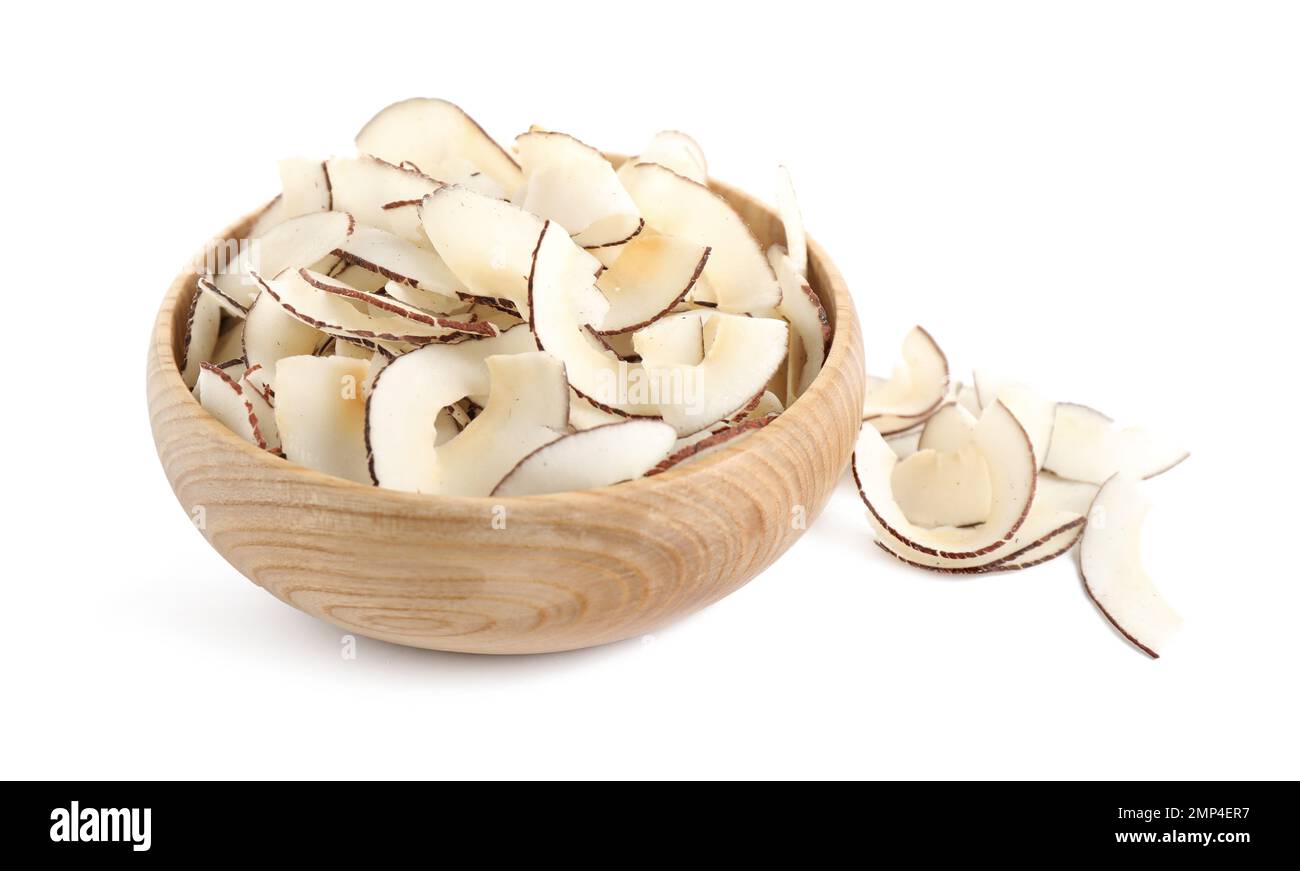 Tasty coconut chips in wooden bowl isolated on white Stock Photo - Alamy