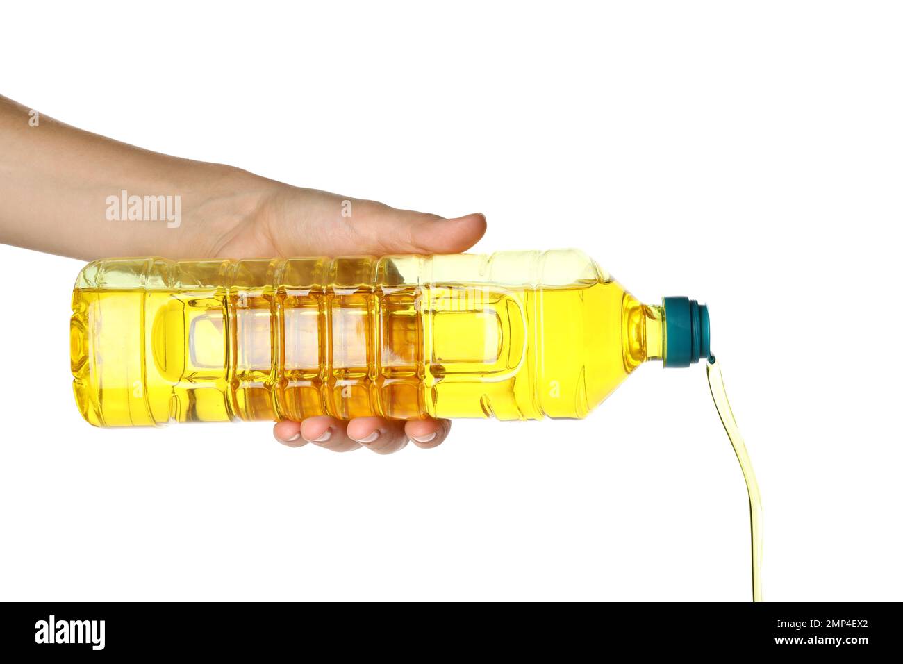 Closeup woman pouring oil Cut Out Stock Images & Pictures - Alamy