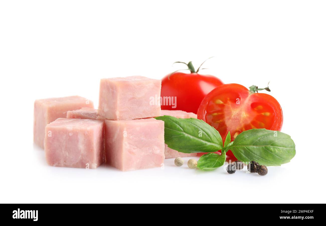 Cubes of tasty fresh ham with basil, tomatoes and pepper isolated on ...