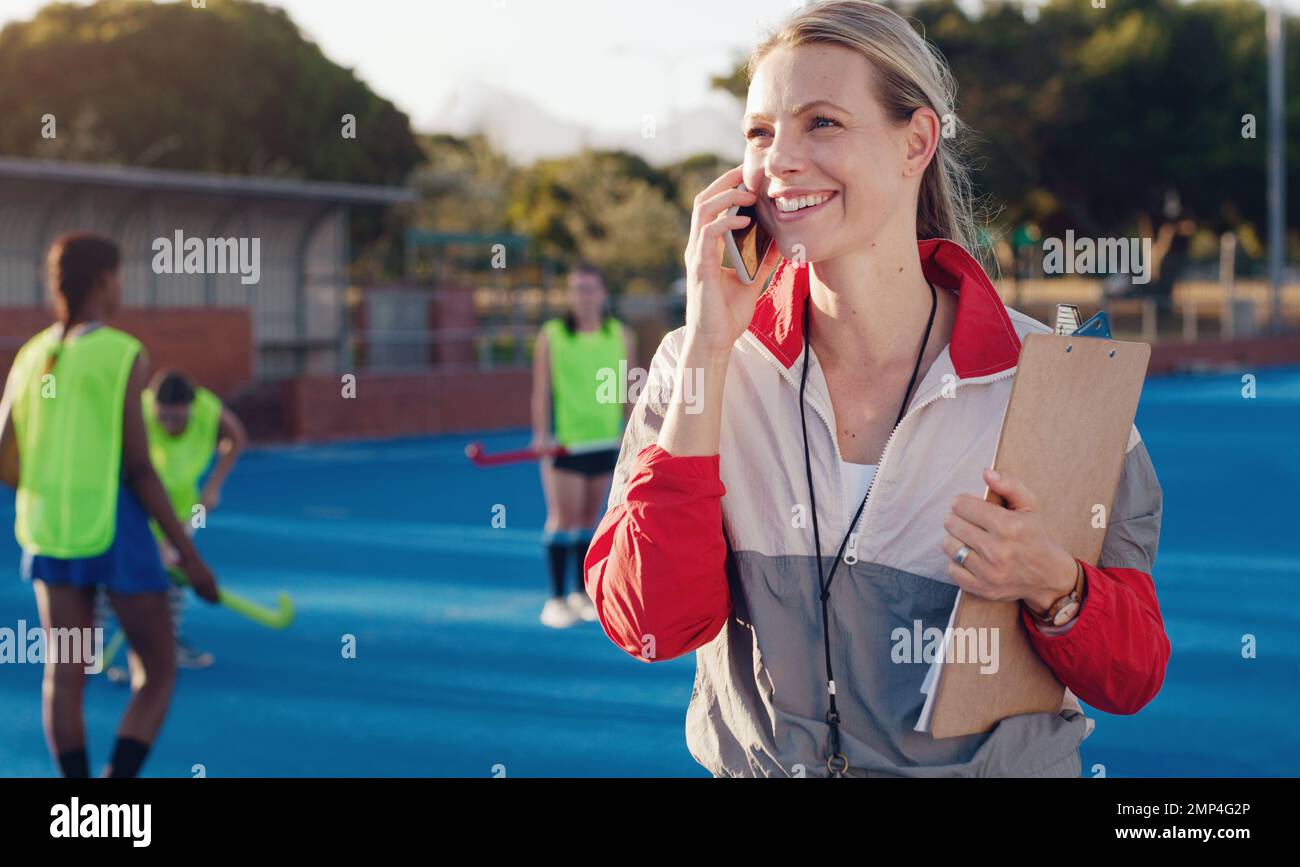 Hockey, trainer and phone call by woman at a stadium for training ...