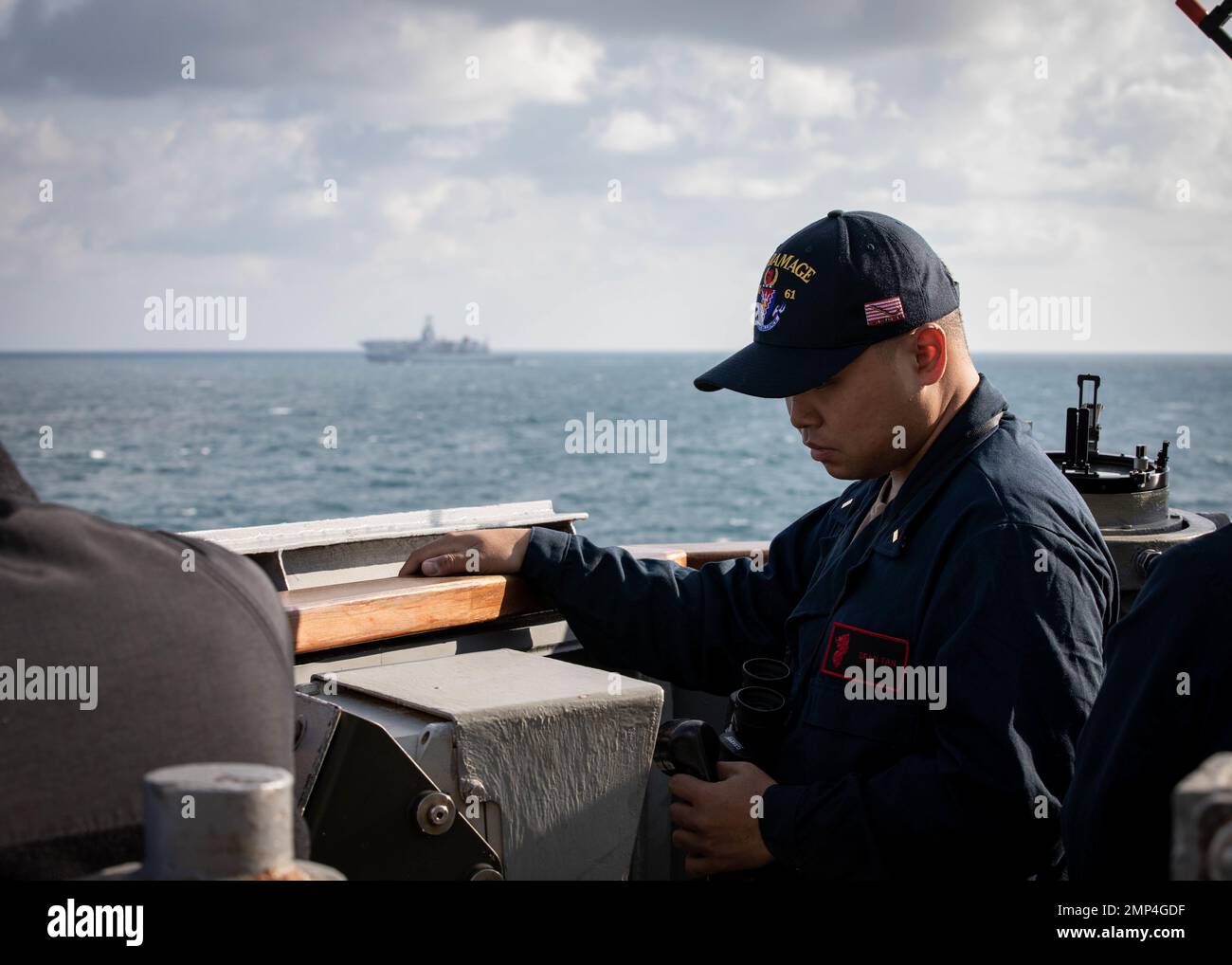 Ensign Sean Tan, assigned to the Arleigh Burke-class guided-missile ...