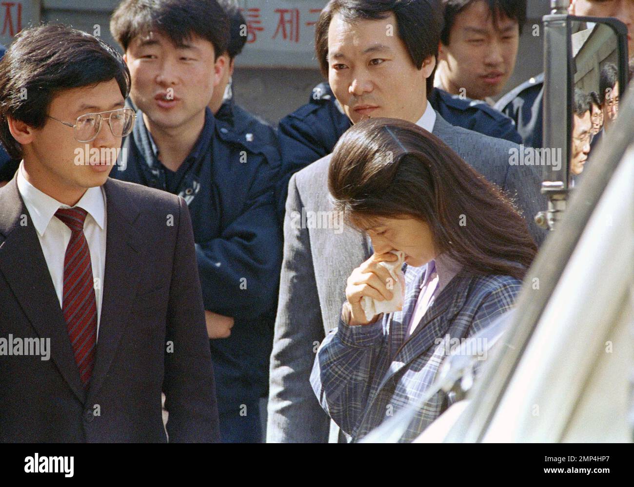 Confessed North Korean agent Kim Hyon-hui weeps holding a handkerchief ...