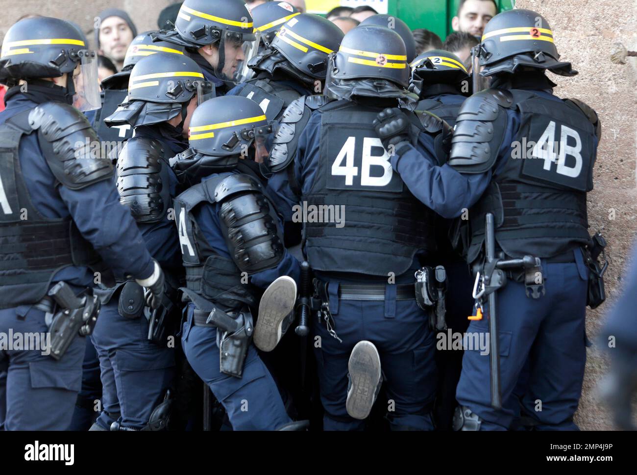 Riot police officers move penitentiary staff as they block the ...